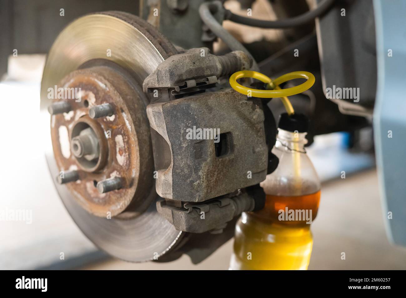 Automatic change of brake fluid in a car service Stock Photo - Alamy