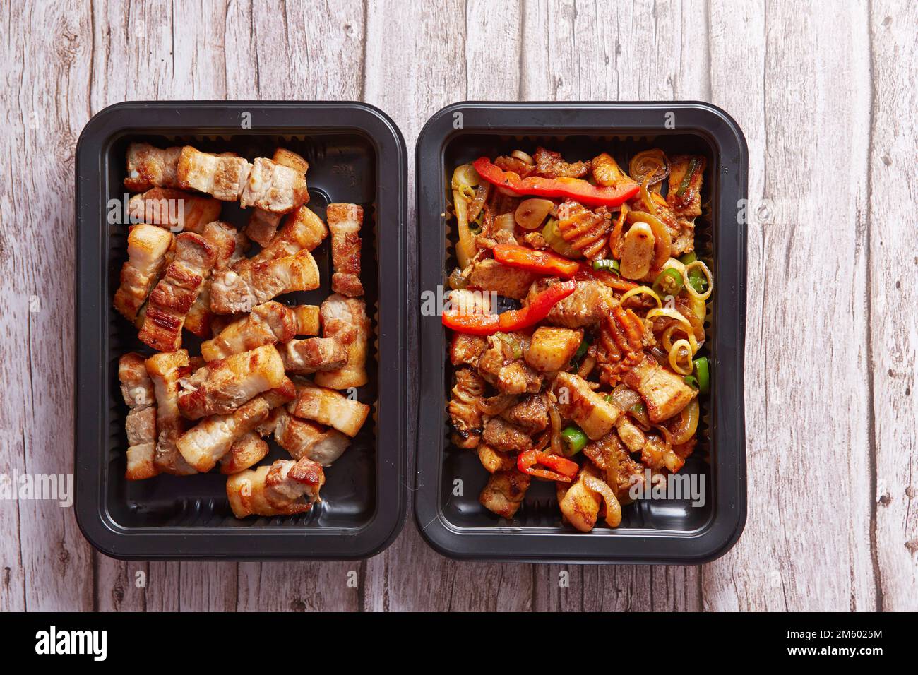 Stir-fried Pork and Spicy Pork in Containers Stock Photo - Alamy