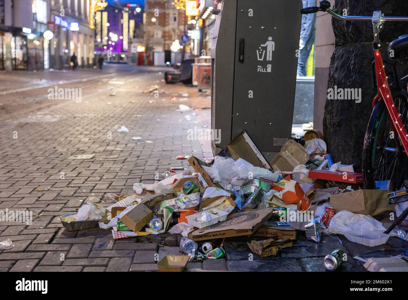 AMSTERDAM - Mess from New Year's Eve on the Leidsestraat. Cleaning ...