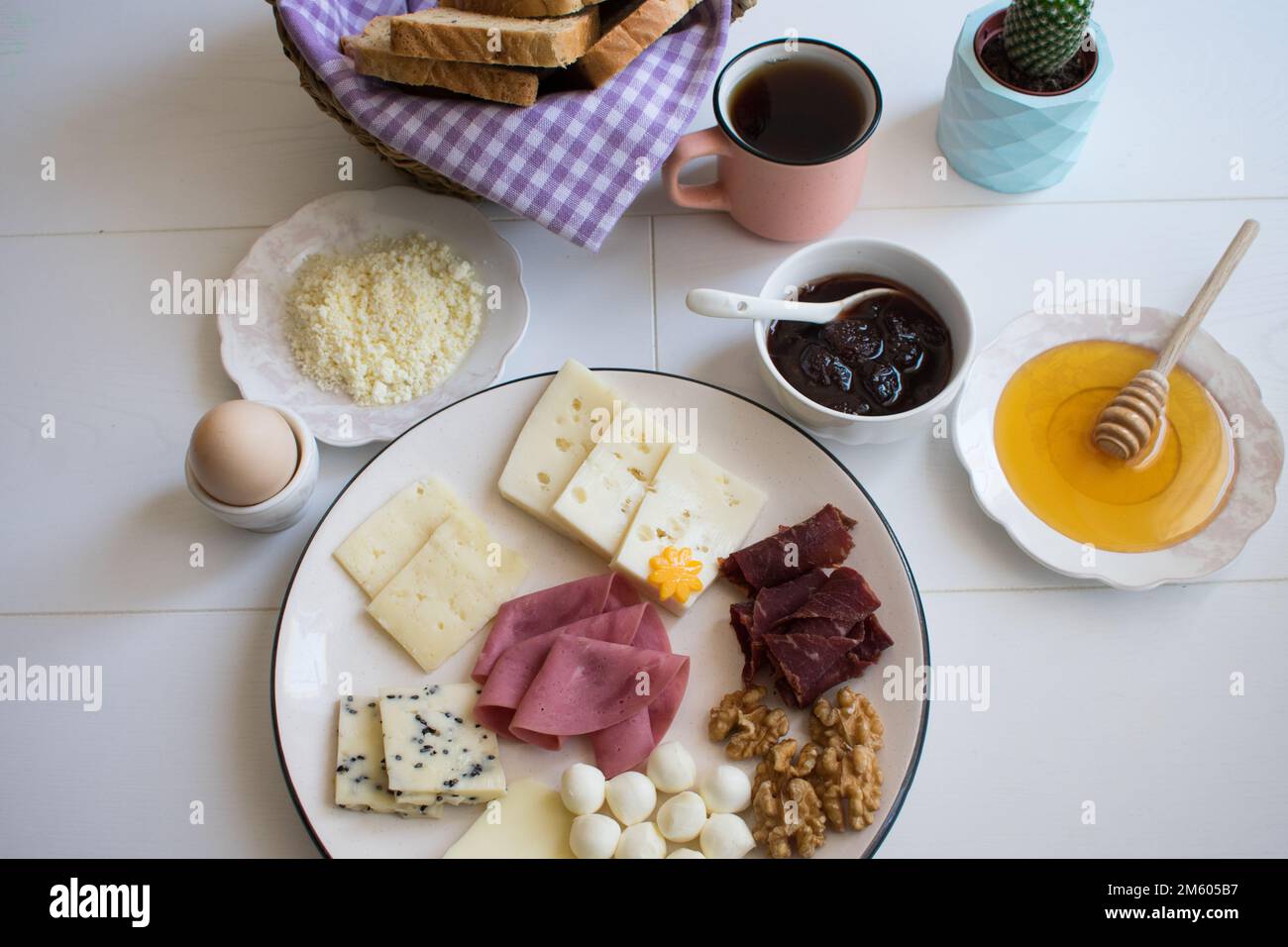 Delicious breakfast presentation, cheese varieties, honey, walnuts ...