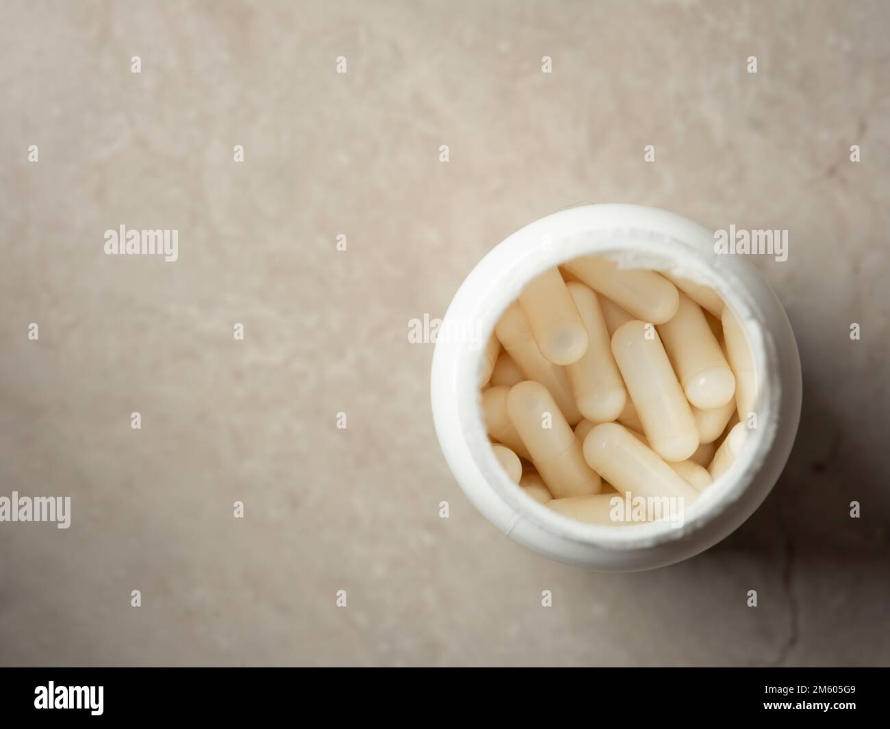 White capsule pills in a case Stock Photo - Alamy