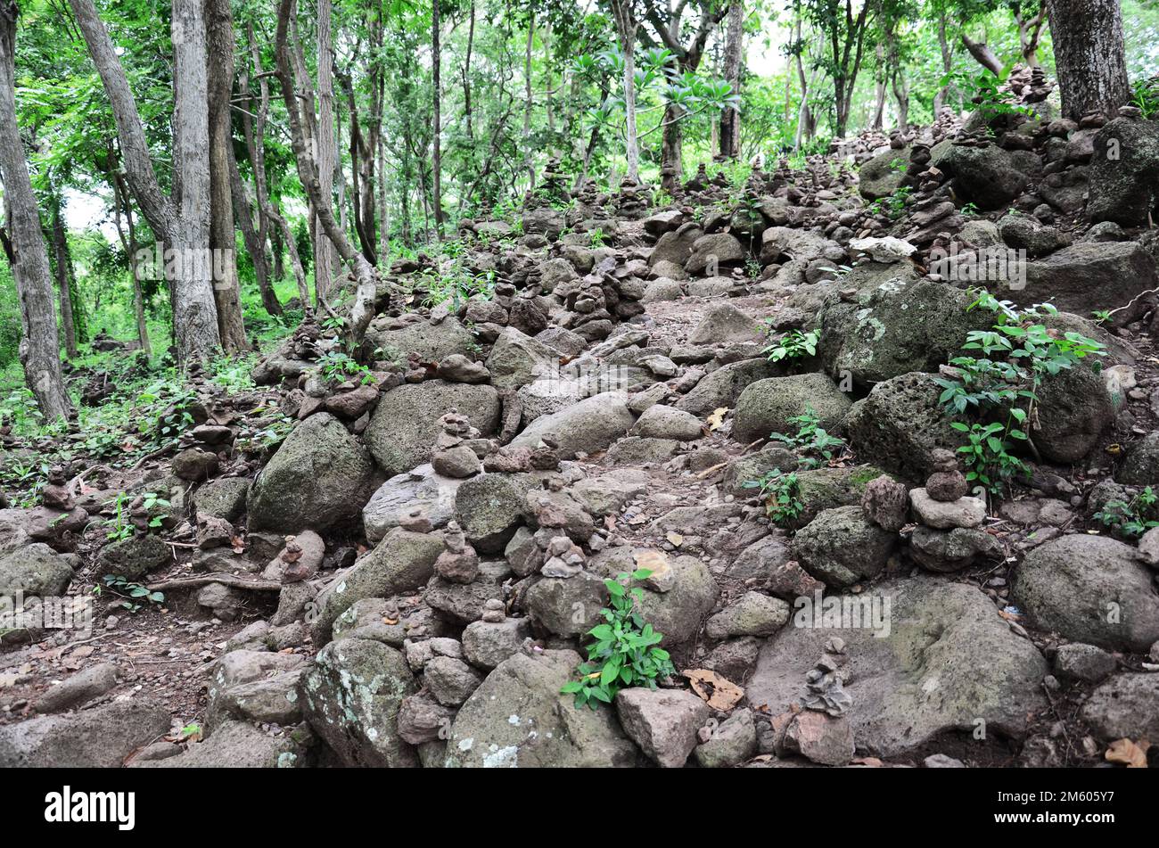 Thai people and foreign travelers build rock stone tower for respect ...