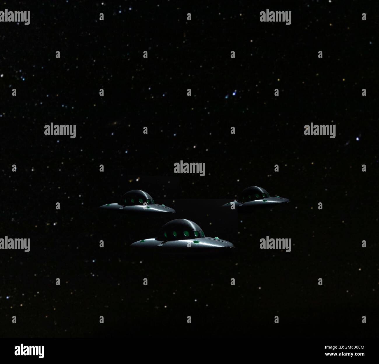 Formation of three UFOs with stars and copy space above Stock Photo - Alamy