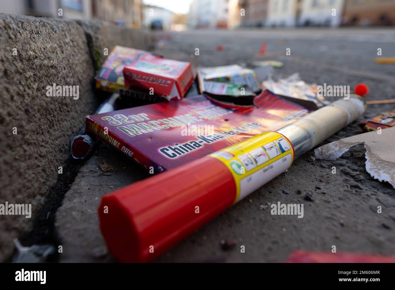 Munich, Germany. 01st Jan, 2023. Packaging and spent fireworks lie on a ...