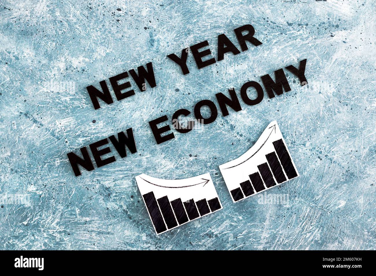 new year new economy text with graphs showing growth stats going down ...