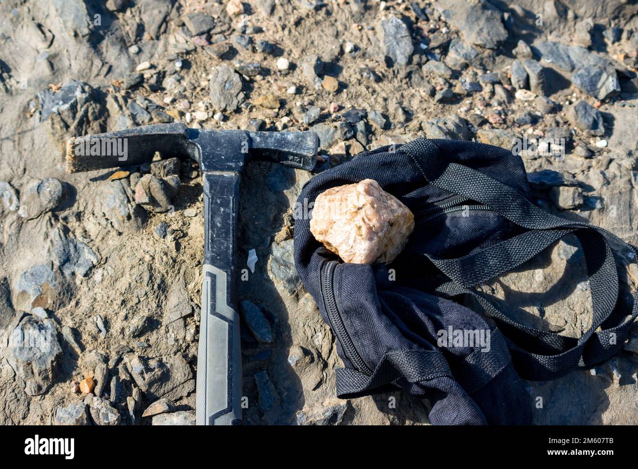 Hammer and specimen of feldspar stone, rockhounding Stock Photo - Alamy