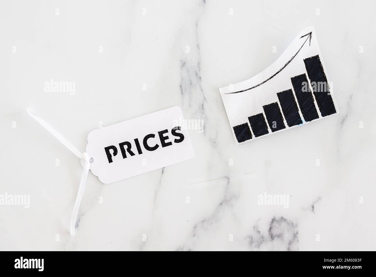 Prices text on product tag next to graph with stats going up, concept ...