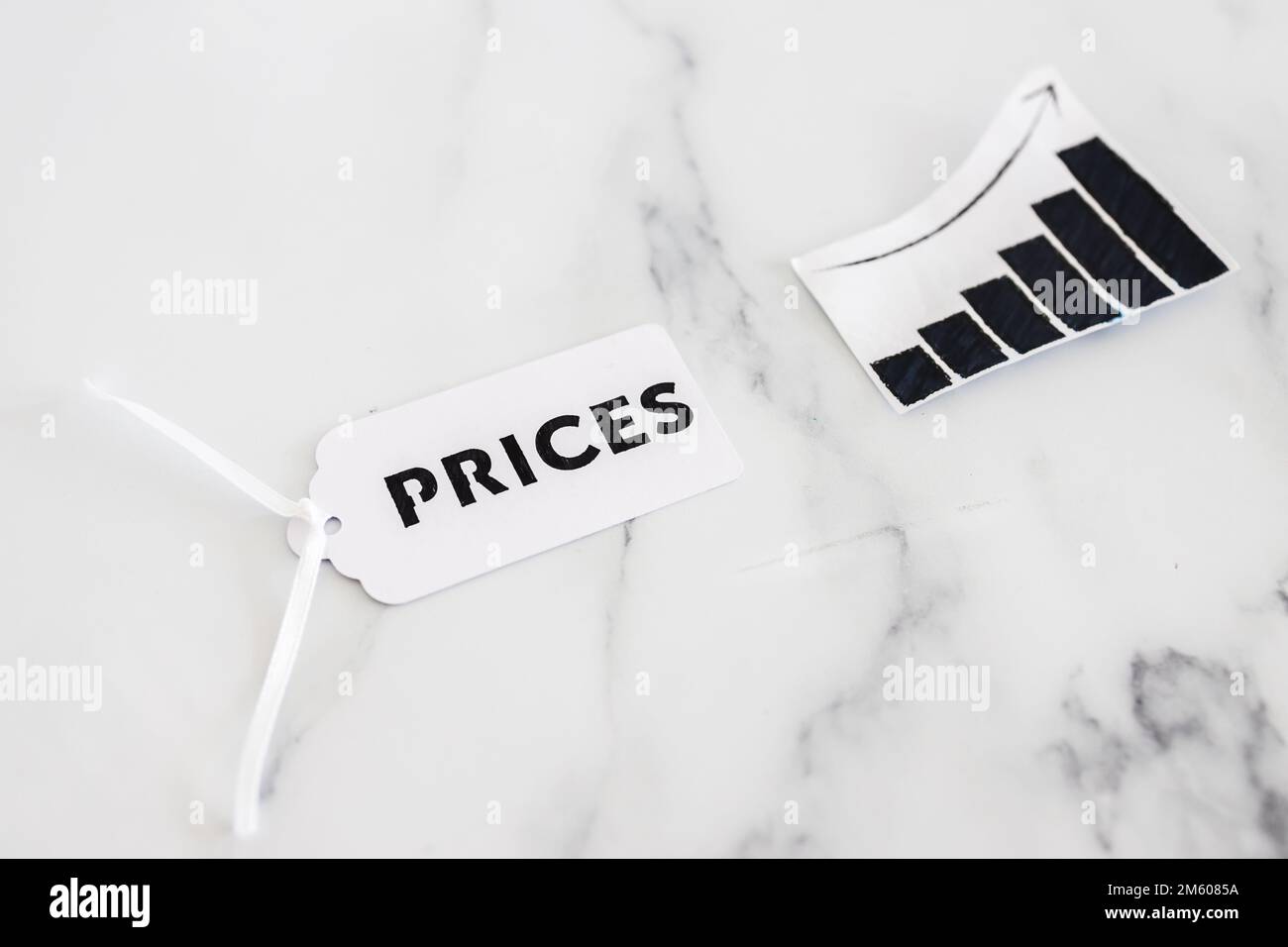 Prices text on product tag next to graph with stats going up, concept ...