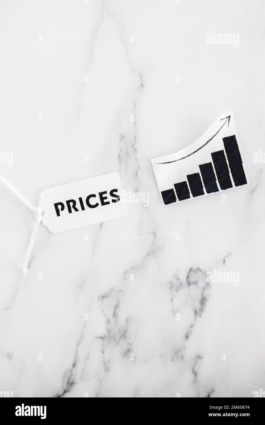 Prices text on product tag next to graph with stats going up, concept ...