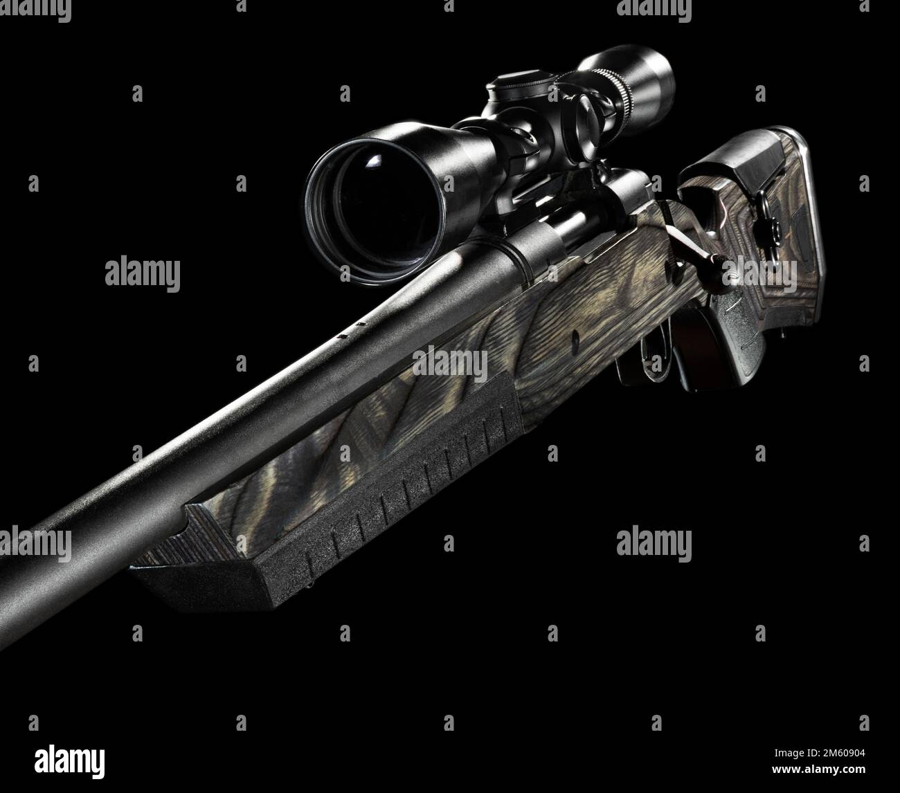 Wood stock on a bolt action rifle with a scope on black Stock Photo - Alamy