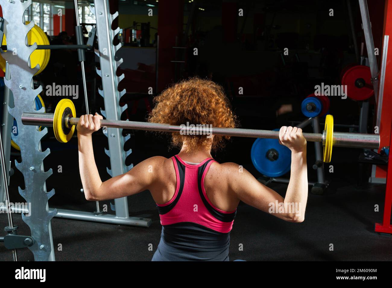 Woman bodybuilder engaged with a barbell in the gym Stock Photo - Alamy