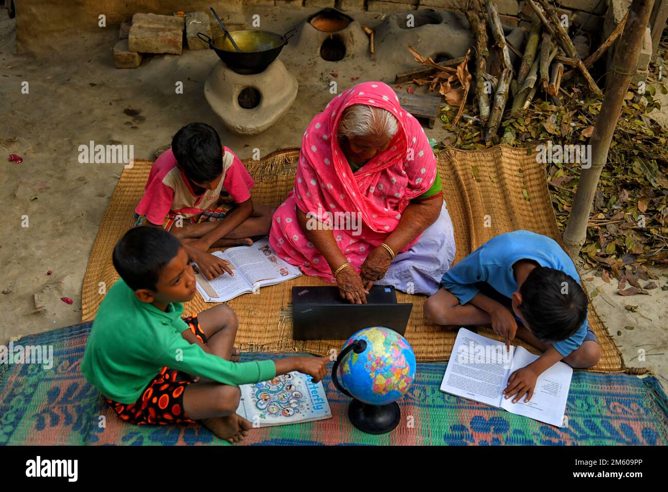 Canning, India. 31st Dec, 2022. Children study with a help of laptop ...