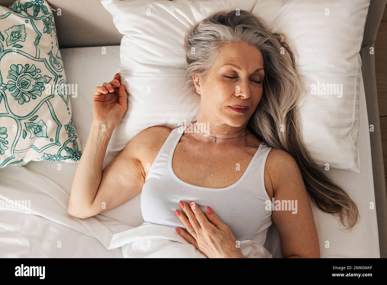 Aged woman sleeping. Senior female taking a nap in the bedroom Stock ...