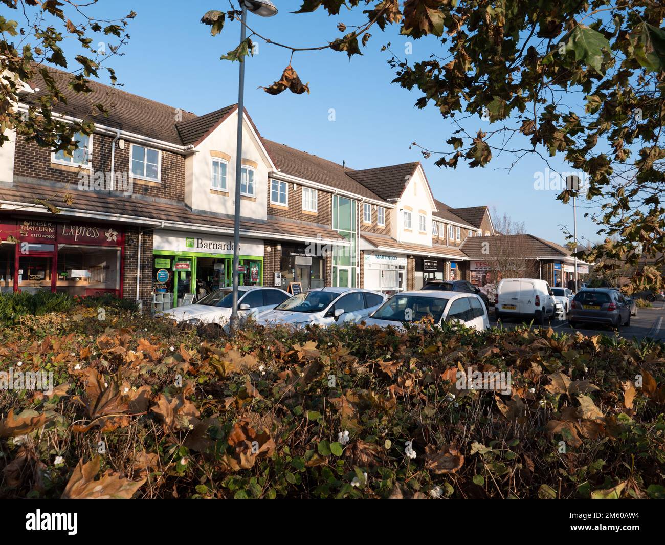 Shopping parade with car parking on local housing estate Stock Photo ...