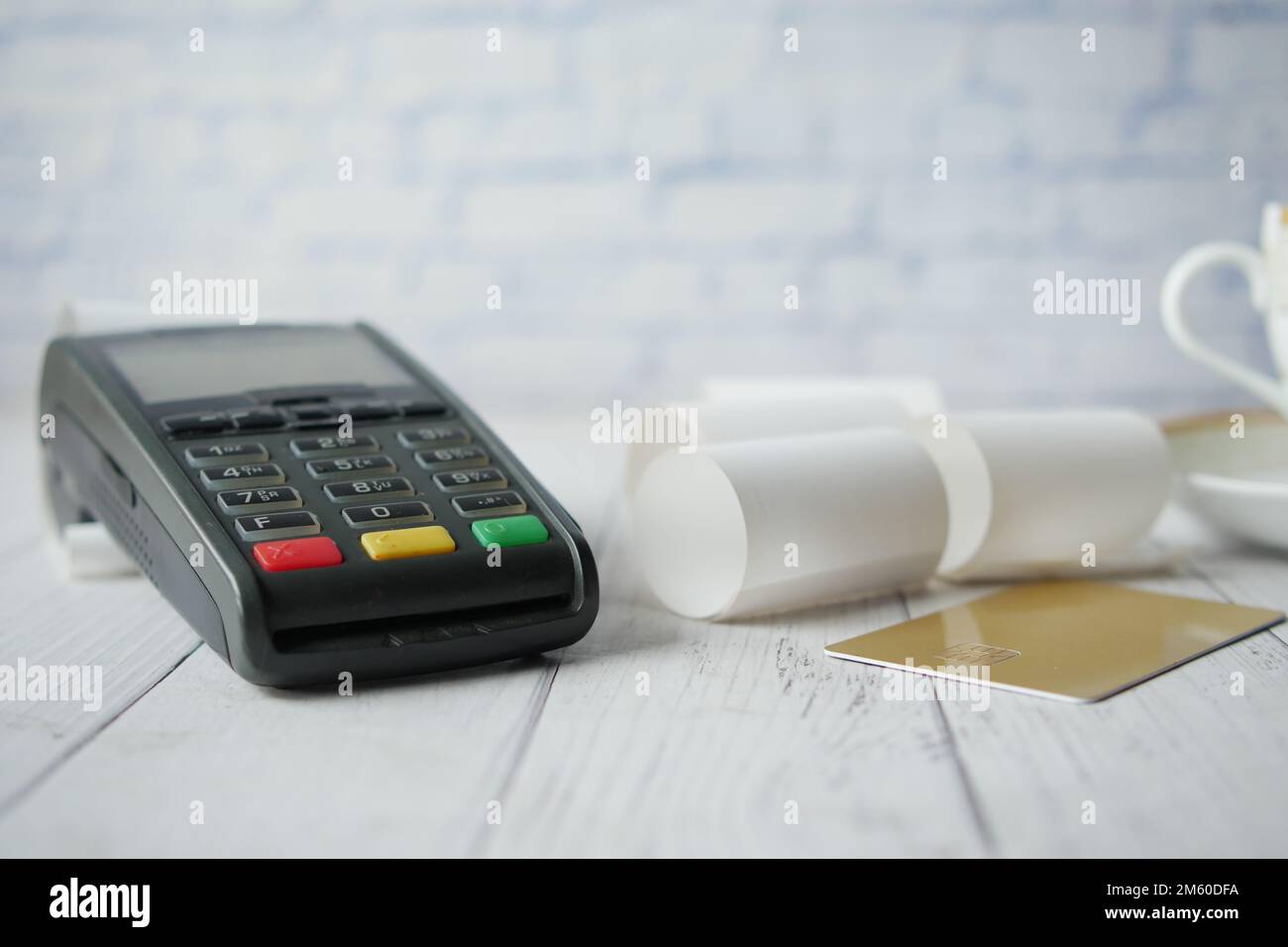 POS machine and long roll paper on blue Stock Photo - Alamy