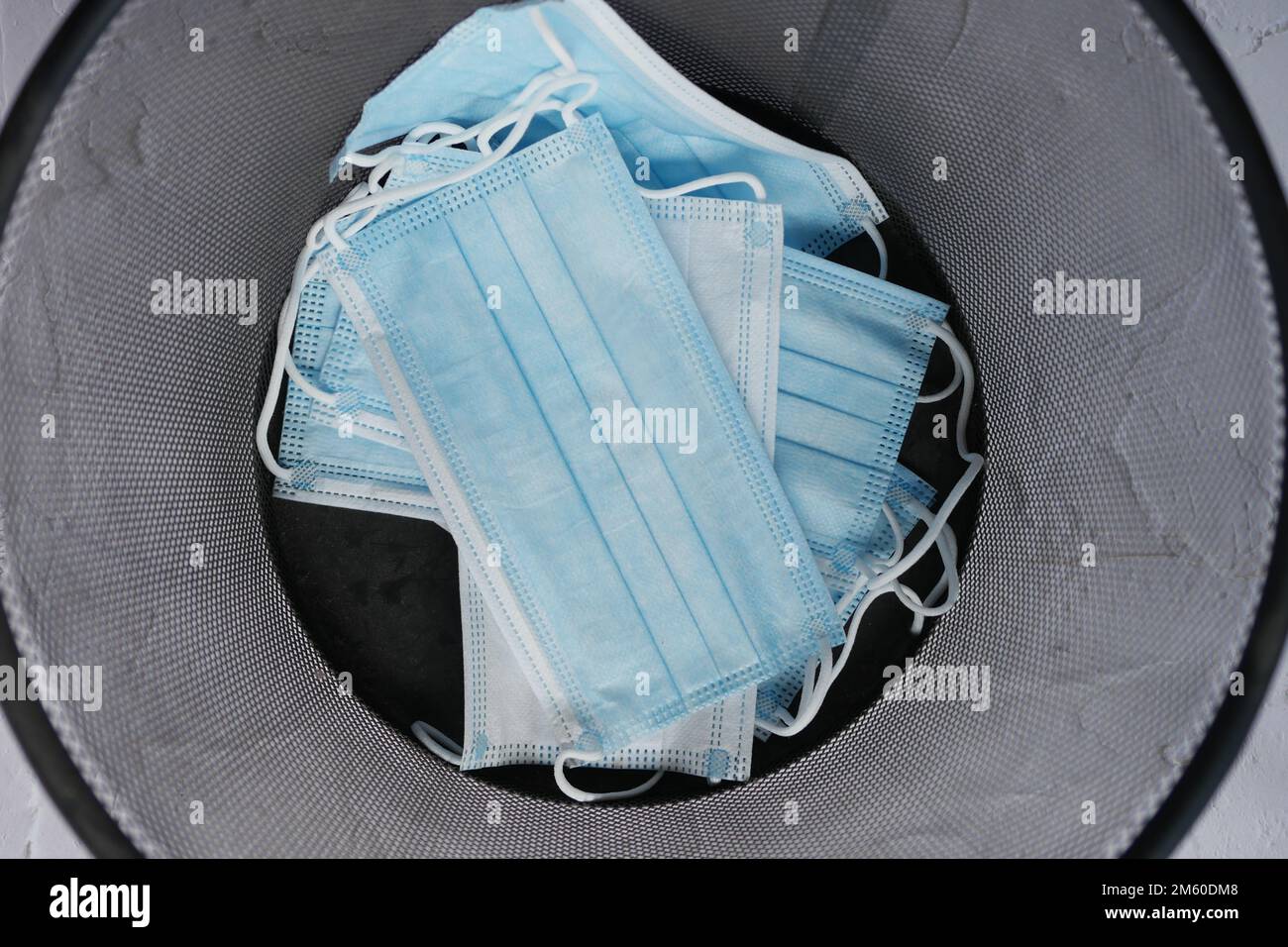 dispose the medical face mask and gloves in a bin, top view Stock Photo ...
