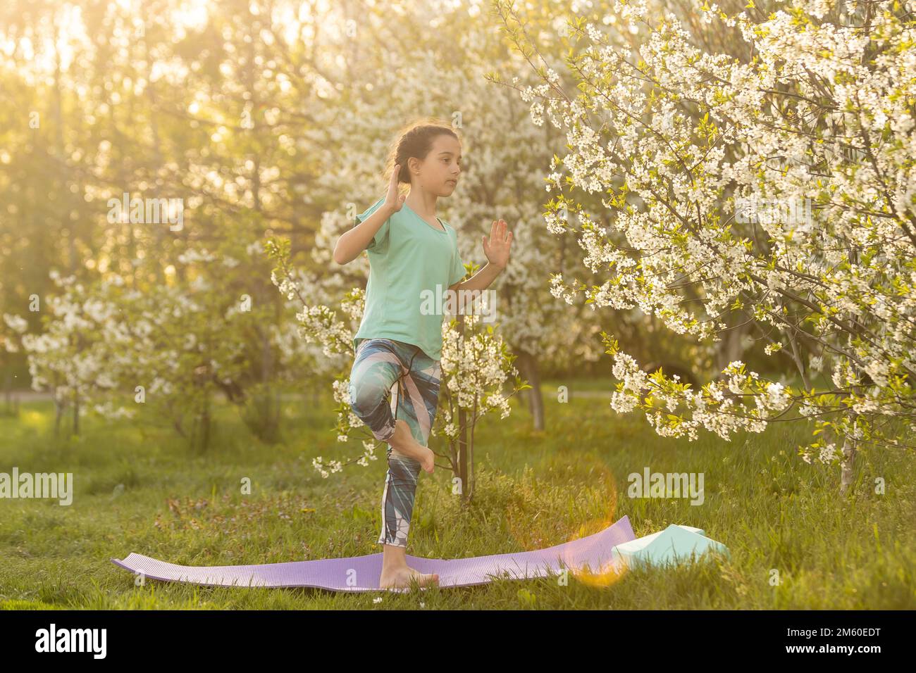 child doing gymnastics exercises. Sports, learning, fitness, stretching ...