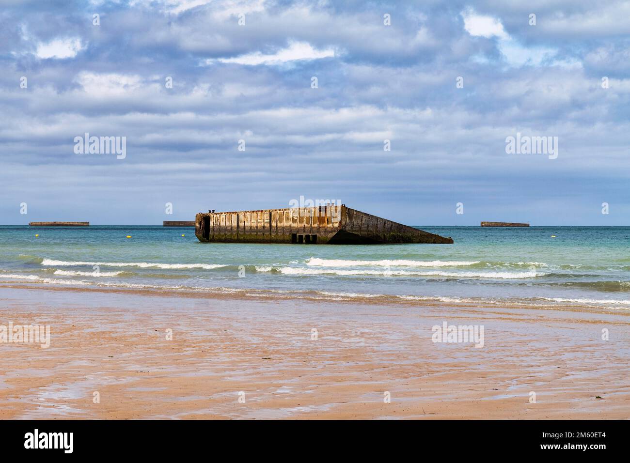 Concrete boxes as artificial breakwaters on the sandy beach, Allied ...