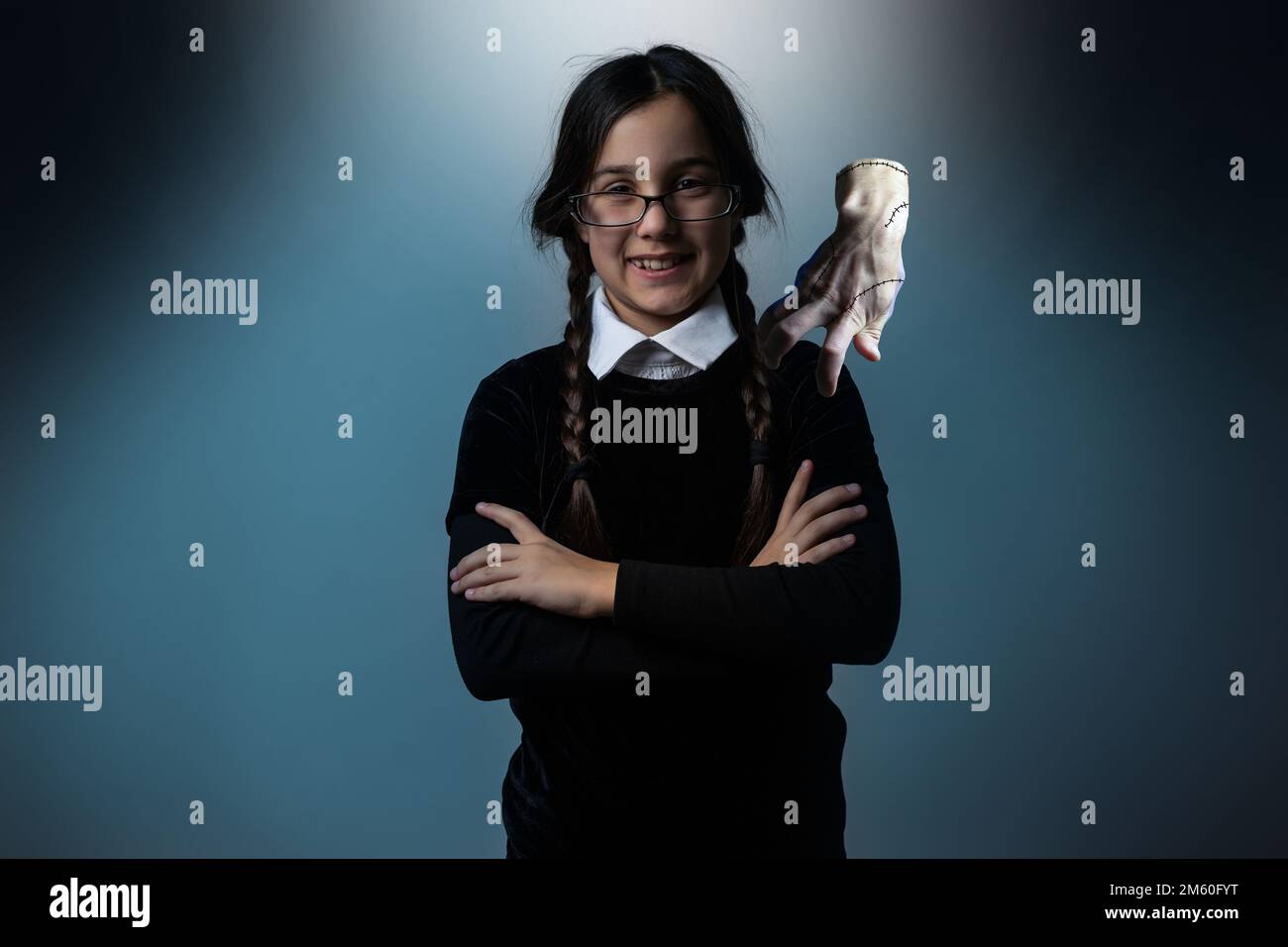 Wednesday student girl on a dark background Stock Photo - Alamy