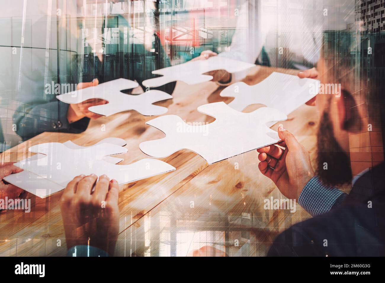 Business team building puzzle pieces hi-res stock photography and ...