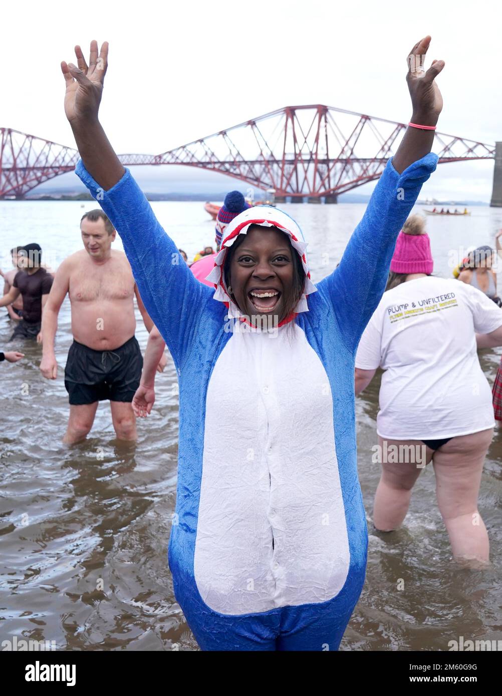 People take part in the Loony Dook New Year's Day dip in the Firth of ...