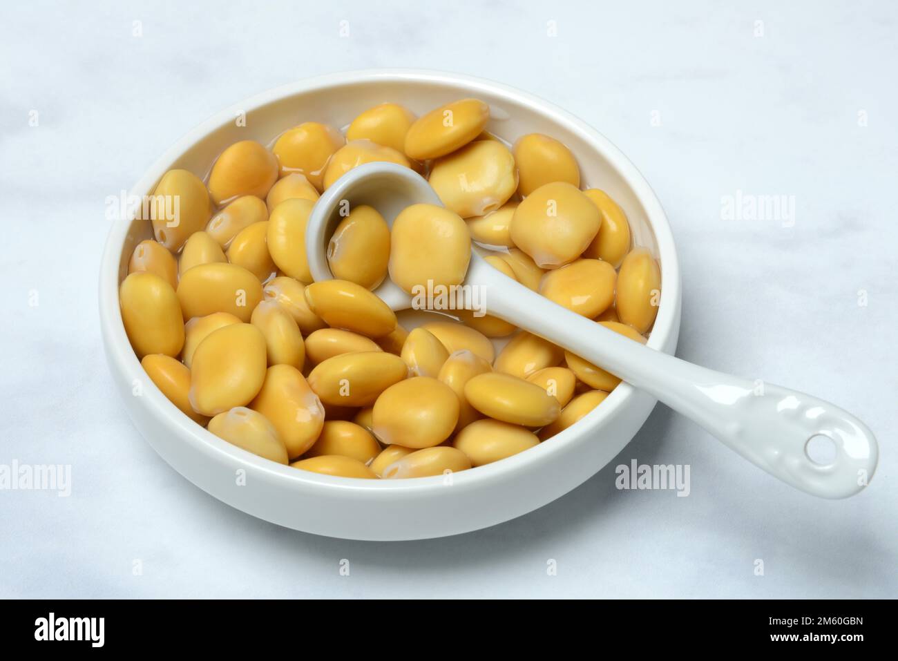 Lupine (Lupinus), pickled lupine seed in small bowls Stock Photo - Alamy
