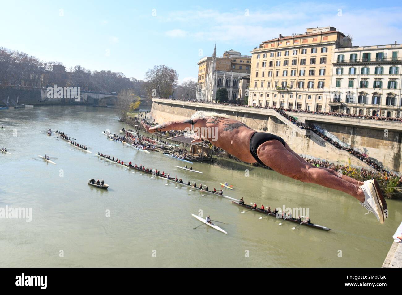 Maurizio Palmulli known as "Mister Ok" dives into the Tiber river as ...
