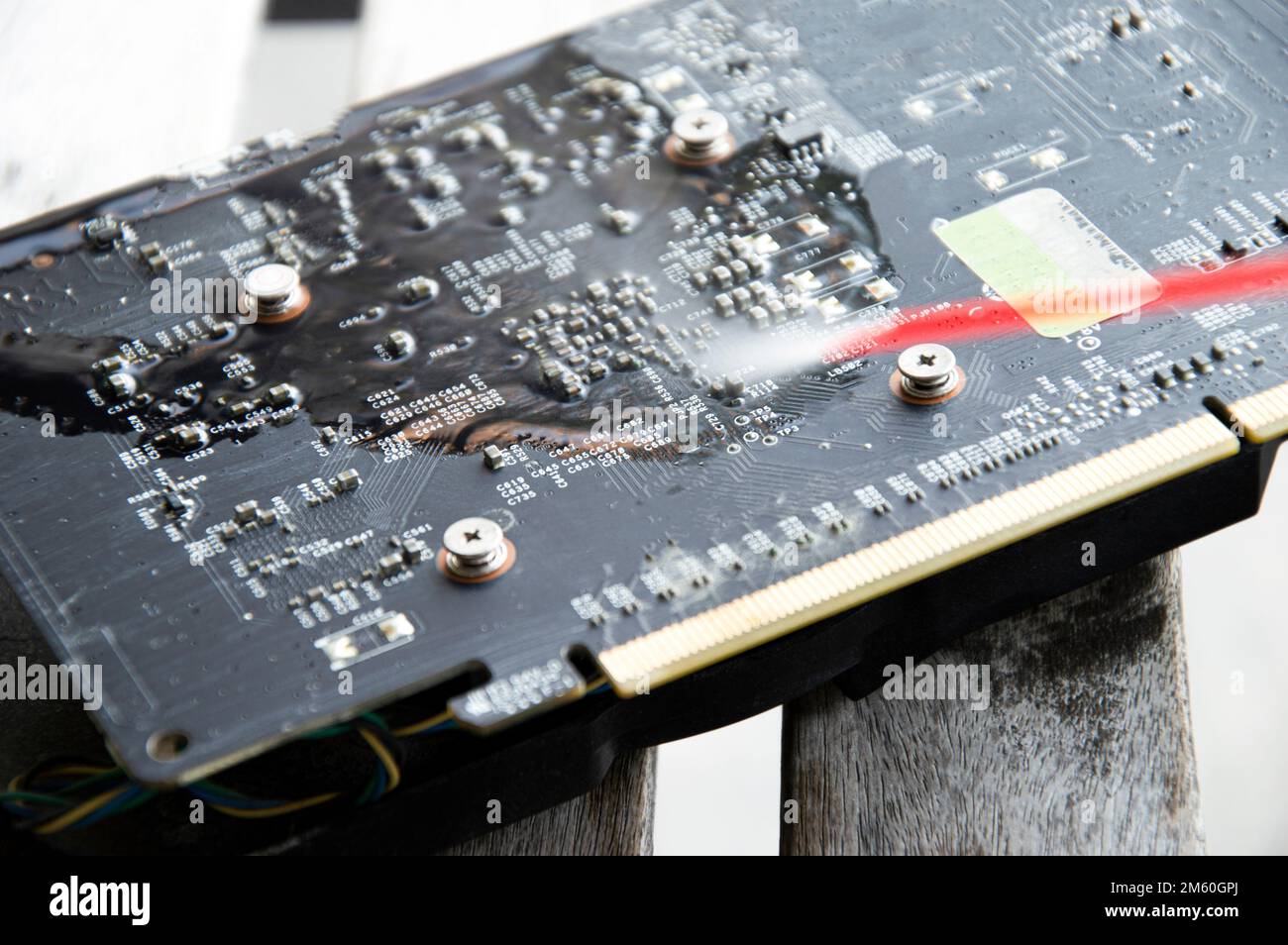 Technician view using spray to clean graphics card Stock Photo - Alamy
