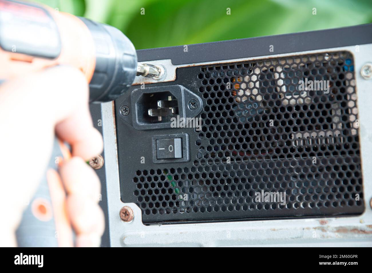 Technician screwing the back of the computer, fixing the computer Stock ...