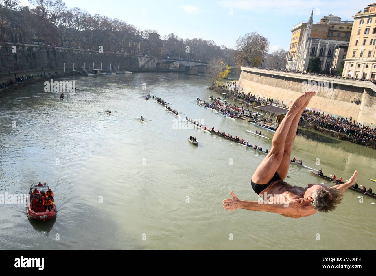 Maurizio Palmulli known as "Mister Ok" dives into the Tiber river as ...