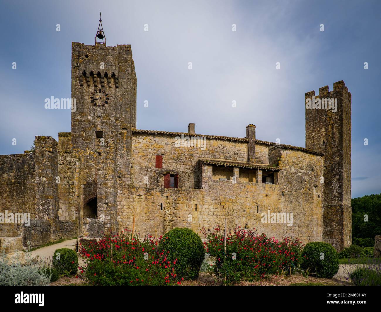 View on the gate of the fortified medieval village of Larressingle in ...