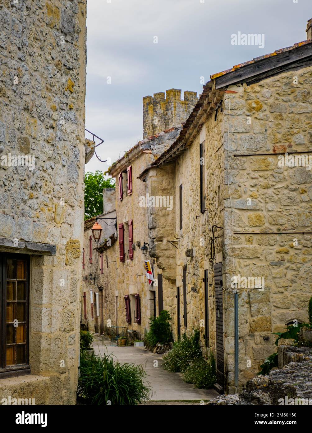 Streets of the quaint fortified village of Larressingle in the South of ...