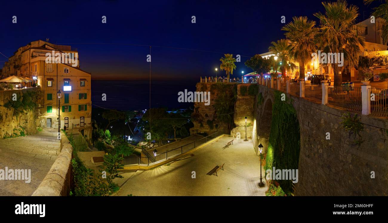 Sea view panorama with the medieval old town of Tropeain the evening ...