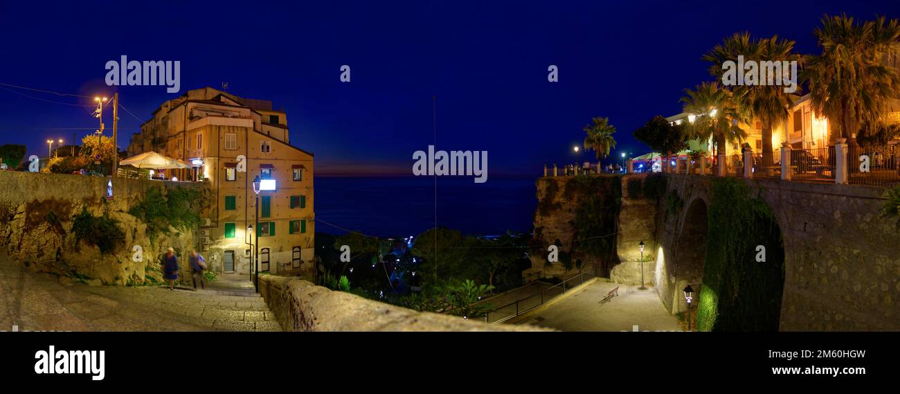 Sea view panorama with the medieval old town of Tropeain the evening ...
