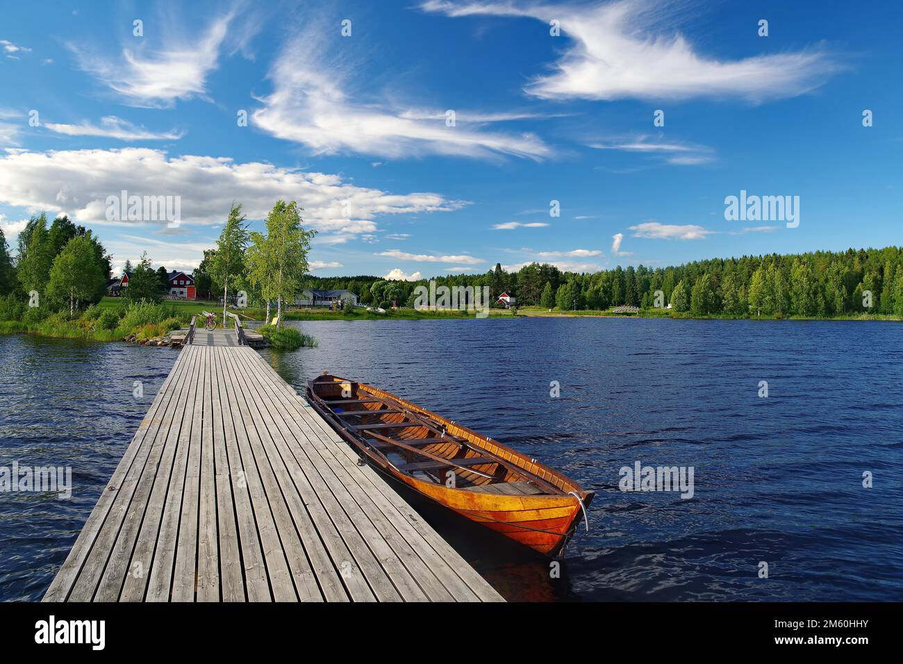 Lake with long jetty and wooden boat, Bathing, Summer, Nurmes ...
