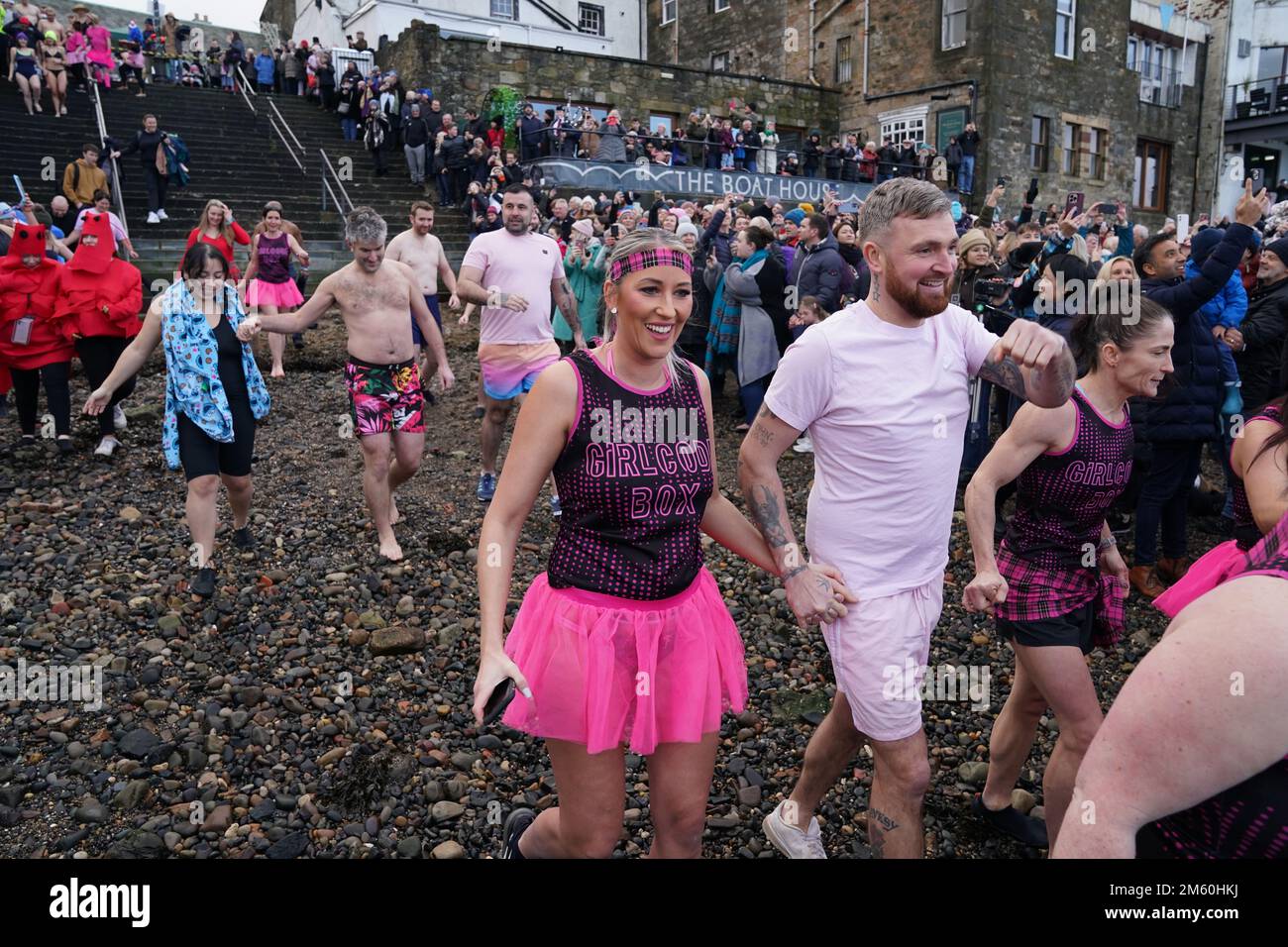 People take part in the Loony Dook New Year's Day dip in the Firth of ...
