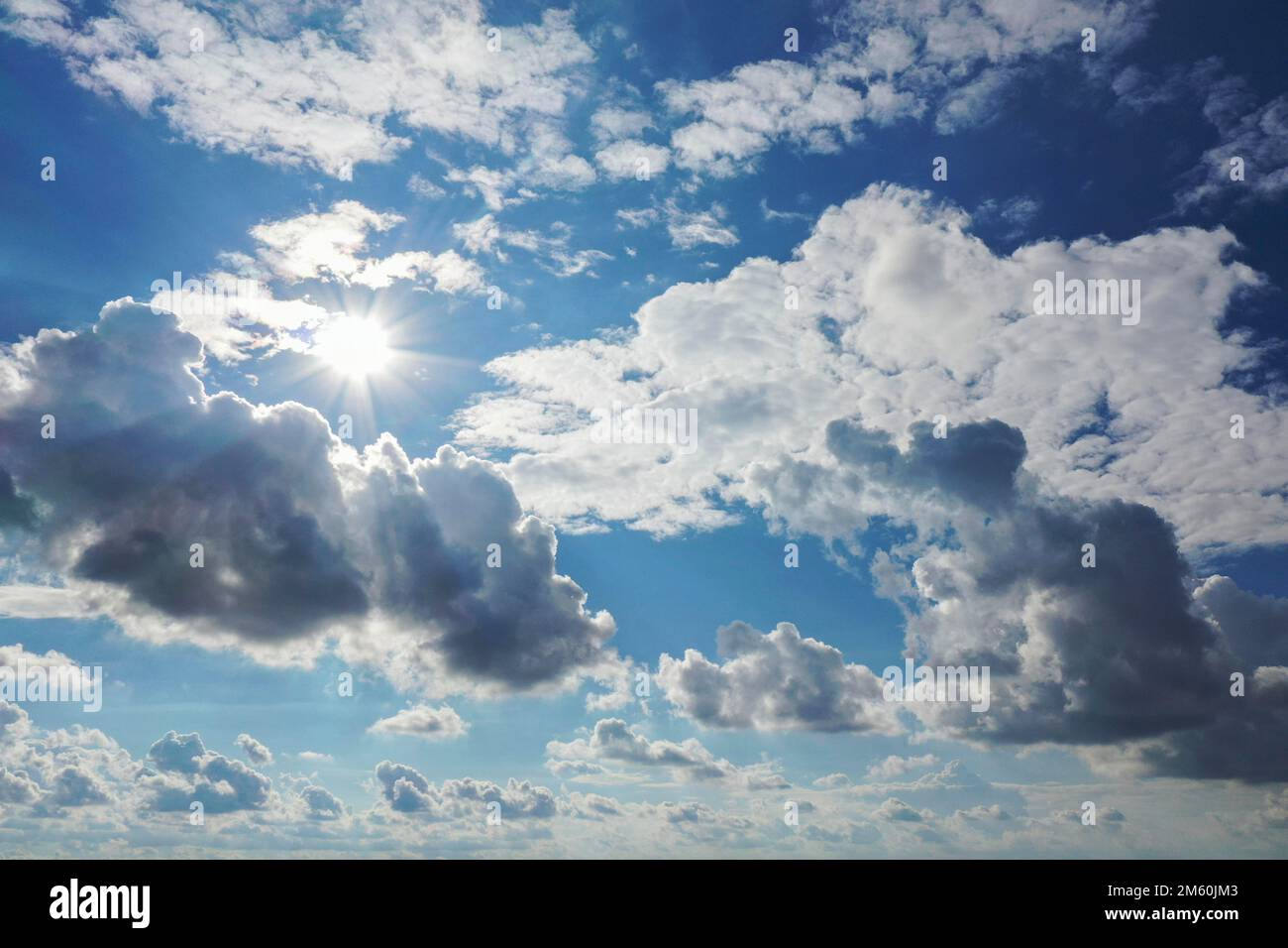 Aerial view, sun shining in the sky with clouds Stock Photo - Alamy