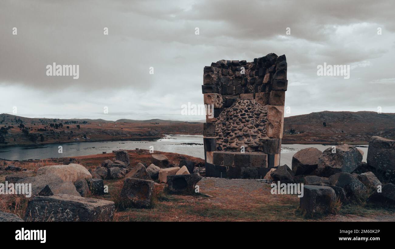 The Sillustani Cemetery on the coast of a lake in Puna, Peru Stock ...