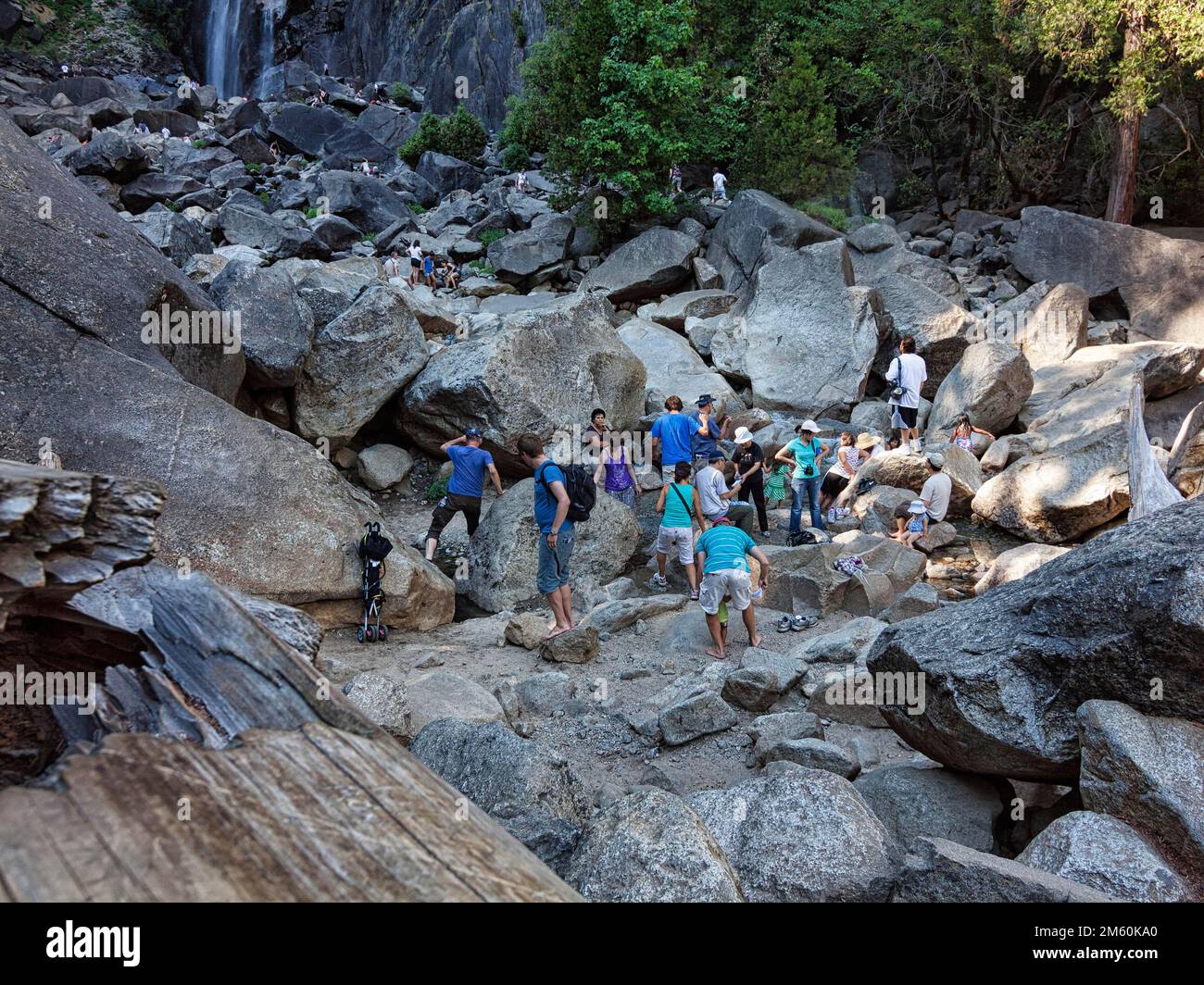 Tourists on boulders, climbing, Yosemite Fall, Yosemite National Park ...