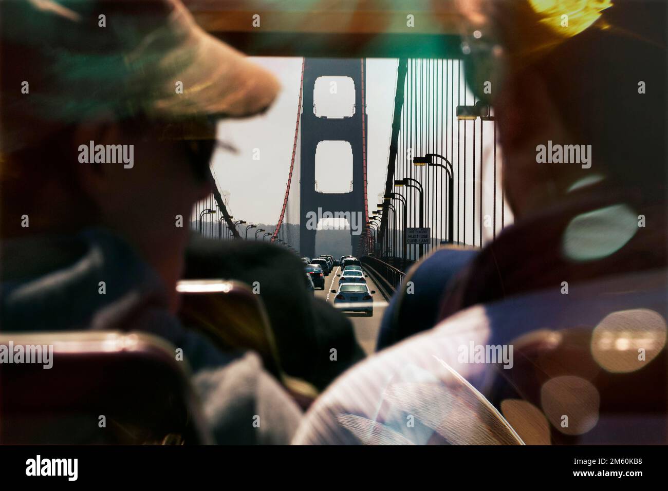 Passengers, tourists enjoying ride over the Golden Gate Bridge in a ...