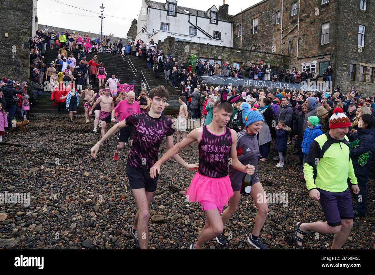 People take part in the Loony Dook New Year's Day dip in the Firth of ...