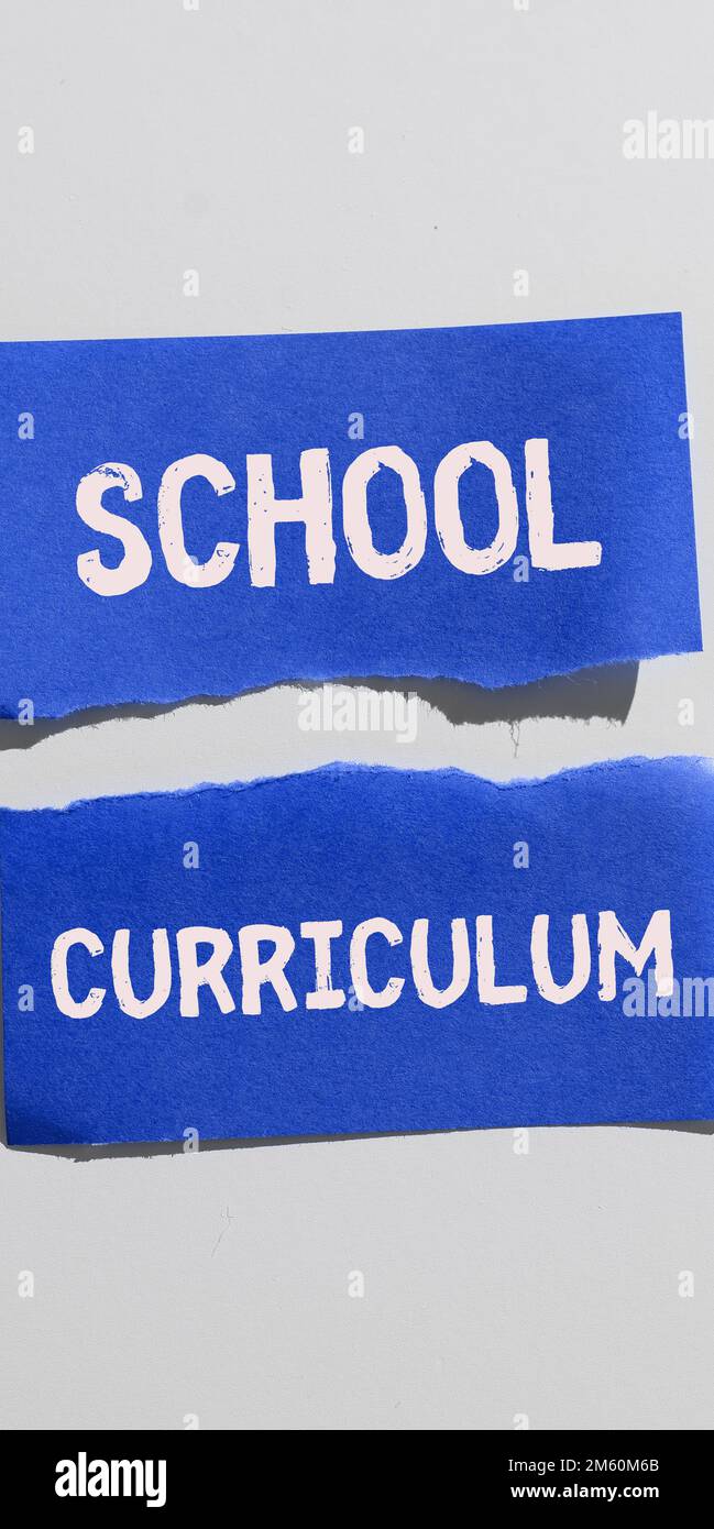Sign displaying School Curriculum, Business overview designed to ...