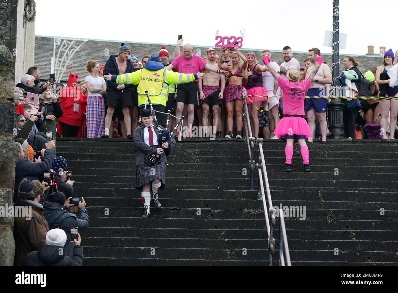 People take part in the Loony Dook New Year's Day dip in the Firth of ...