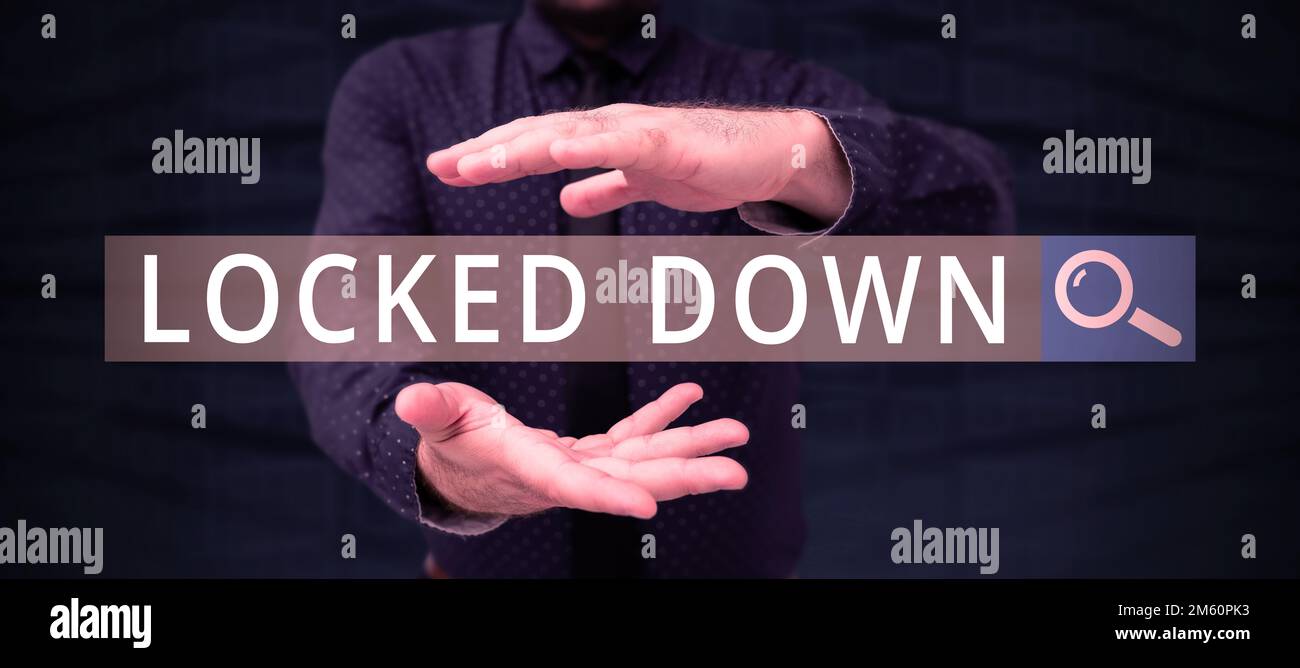 Sign displaying Locked Down. Word for emergency measure which people ...