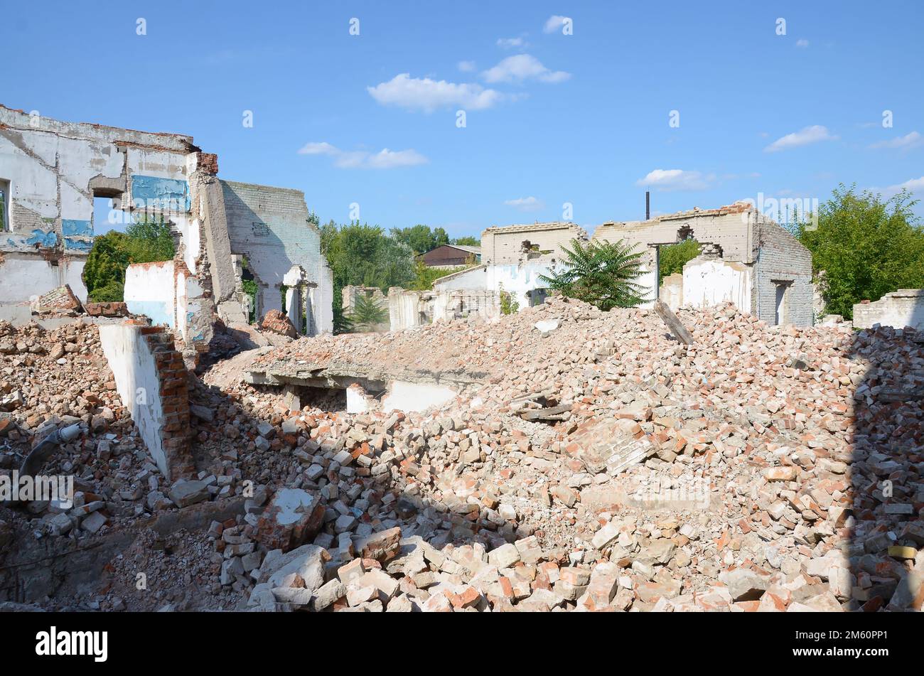 Collapsed industrial multistorey building in daytime. Disaster scene ...
