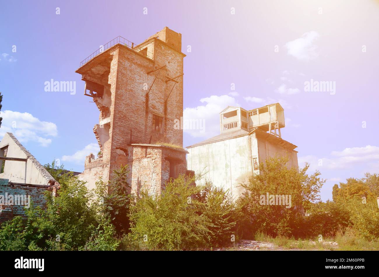 Collapsed industrial multistorey building in daytime. Disaster scene ...