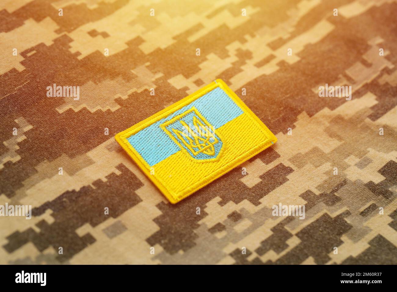 Pixeled digital military camouflage fabric with ukrainian flag and coat ...