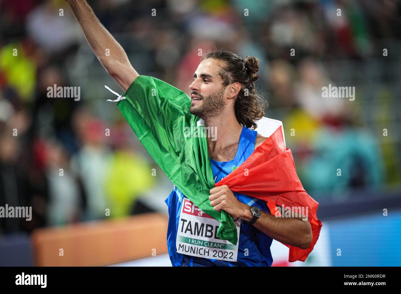 Gianmarco Tamberi with his country's flag after winning the high jump ...