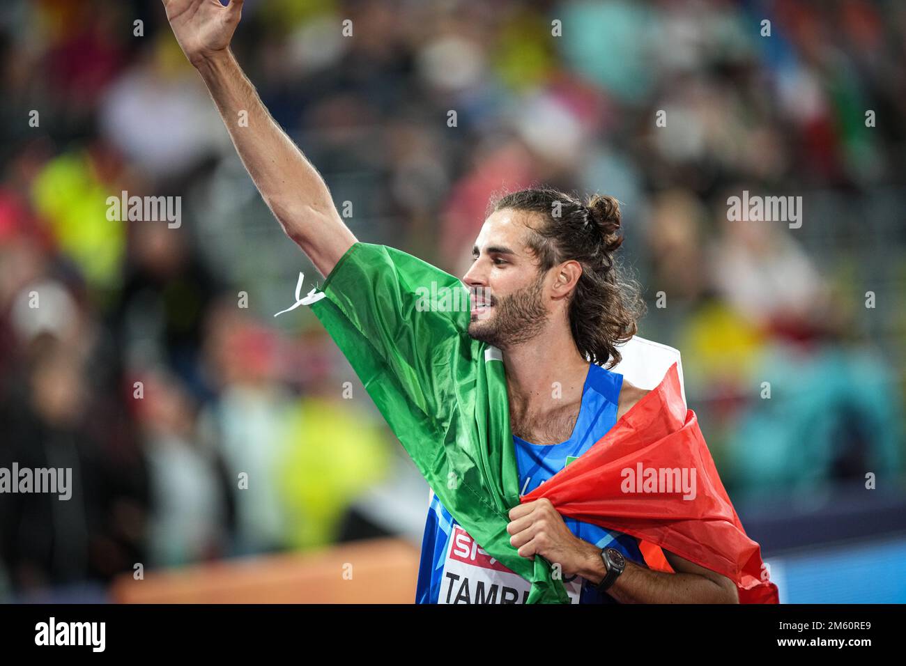 Gianmarco Tamberi with his country's flag after winning the high jump ...