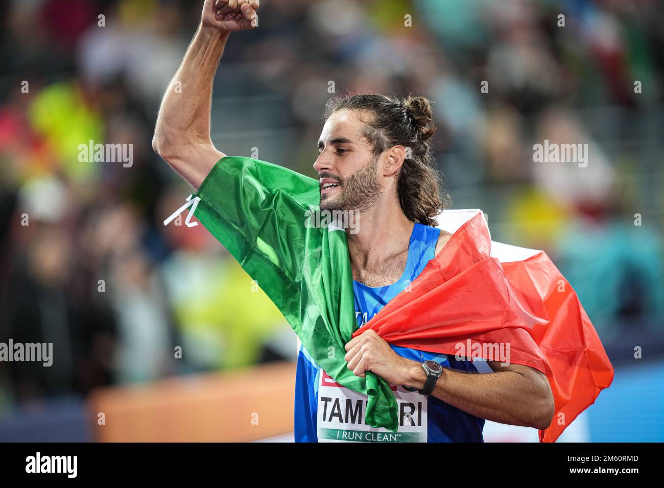 Gianmarco Tamberi with his country's flag after winning the high jump ...